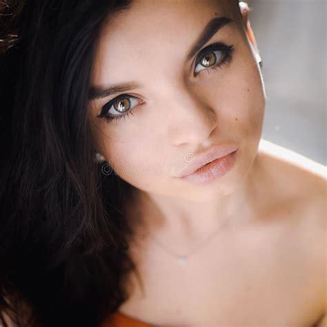 Portrait Of A Beautiful Young Brunette Girl With Expressive Eyes And