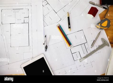 Construction Blueprints With Tools And Tablet Top View Tablet With Architectural Blueprints
