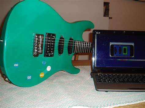 Arduguitar An Arduino Controllable Guitar Hackaday