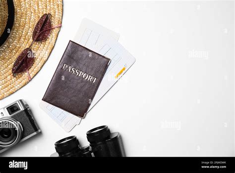 Flat Lay Composition With Passport Tickets And Holiday Items On White