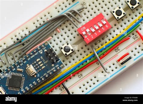 Electronics Prototyping Board Breadboard With An Arduino Pro Mini Clone And An Assortment Of