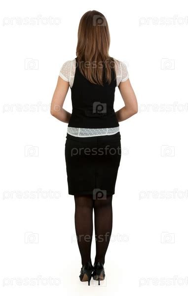 Фотография на тему Девушка в деловом костюме стоит спиной Pressfoto