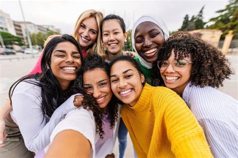 Happy Young Group Of Diverse Girls Taking Selfie Portrait At City