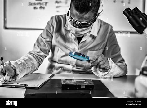 Digital Forensic Science Police Forensic Analyst Examining Computer