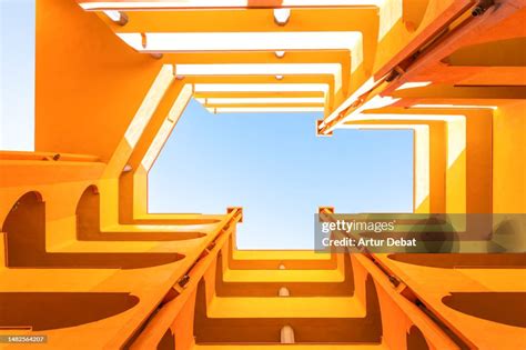 Visual Yellow Architecture With Inner Courtyard Lightwell From Directly Below Blue Sky And