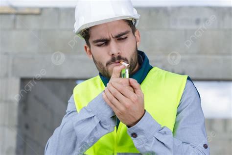Smoking Cigarette At Construction Site Photo Background And Picture For