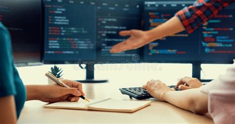 Female Programer Taking A Note While Web Developer Present Program