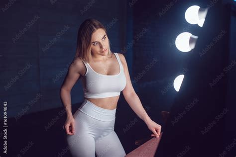 Sexy Girl With Huge Breast In A White Top And Leggings Mock Up Stock