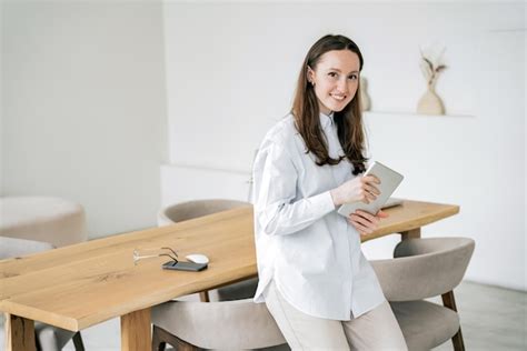 Premium Photo Female Programmer Student In A Blue Shirt Uses A Laptop