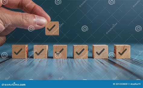 Alignment Of Wooden Blocks With Checkmarks On A Blue Surface Representing Efficiency And