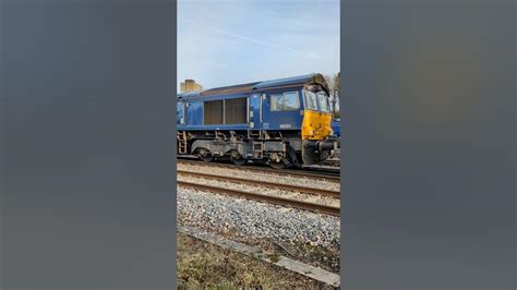 Class 66 66304 Unlivered Passing Leicester North 5225