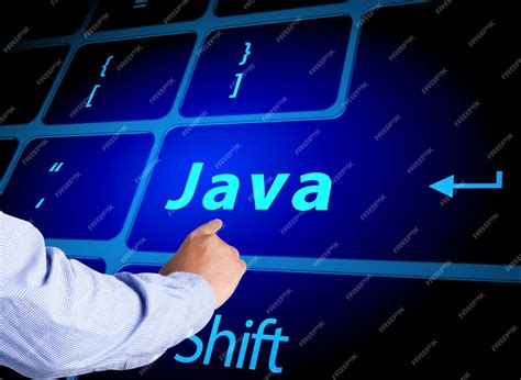 Premium Photo Hand Pressing Keyboard Java Button