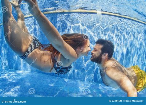 Positive Couple Sitting Inside Of Recreational Vehicle Looking At