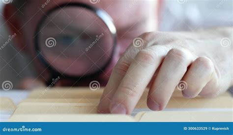 Employee Looks Through Magnifying Glass And Searches For Required Document Stock Video Video