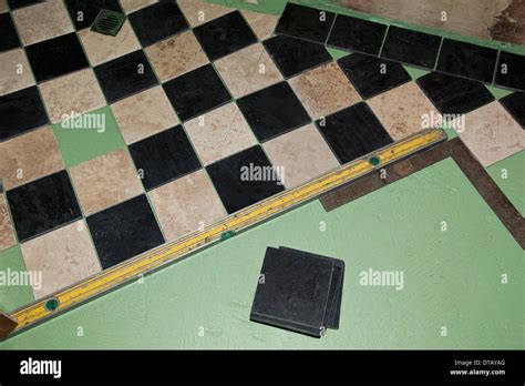 Installing Floor Tiles Stock Photo Alamy