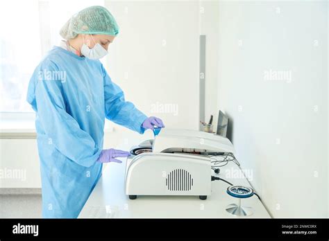 Hematologist Puts Samples Into A Centrifuge In A Testing Unit Stock Photo Alamy