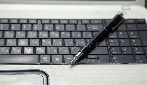 Pen And Notepad On The Computer Keyboard Stock Photo Image Of
