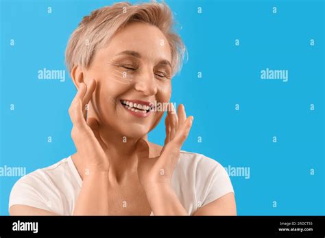 Mature Woman With Marked Face For Filler Injection On Blue Background Closeup Stock Photo Alamy