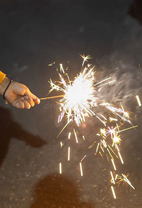 Pencil Crackers Or Indian Phuljhadi Fireworks Holding In Hand At Diwali