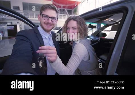 Bloggers Guy With Girl With Keys Record Video In Live Broadcast On Mobile Phone Near New