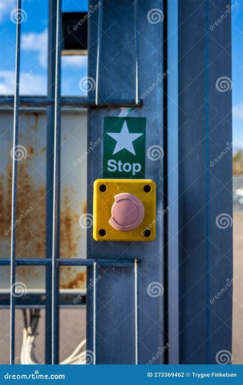 Weathered Emergency Stop Button On A Metal Gate Editorial Photography