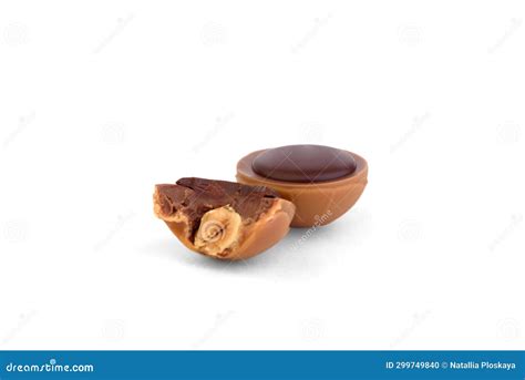 Bitten Caramel Candy With Hazelnut And Chocolate Isolated On White