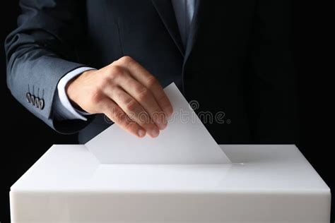 Man Putting His Vote Into Ballot Box On Black Closeup Stock Photo Image Of Parliament
