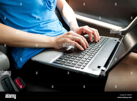 Girl With Laptop Computer In A Car Stock Photo Alamy