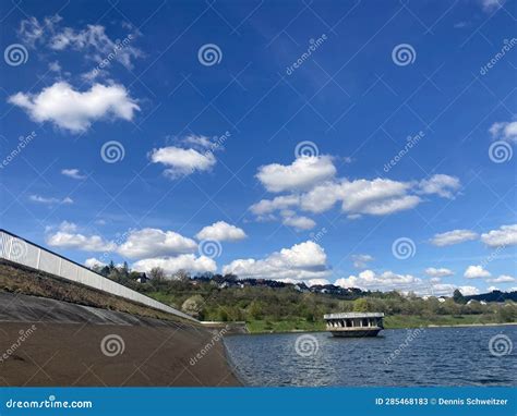 A Reservoir With Dam On One Side And Overflow Protection Stock Image