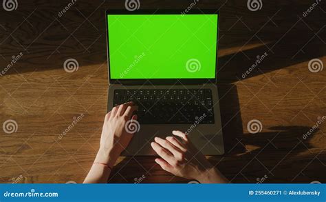 Top View Of A Woman Hand Scroll On A Laptop Computer Touchpad With Green Screen Chroma Key Stock