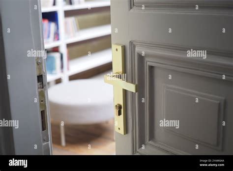 Open Door Concept With Door Handle And Blur Interior Room Background