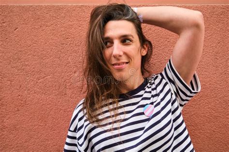 Trans Woman Smiling With Long Hair Wearing Transgender Flag Pin Stock Photo Image Of Cheerful