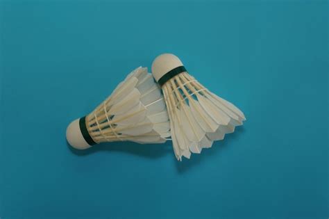 Premium Photo Shuttlecock On The Blue Background