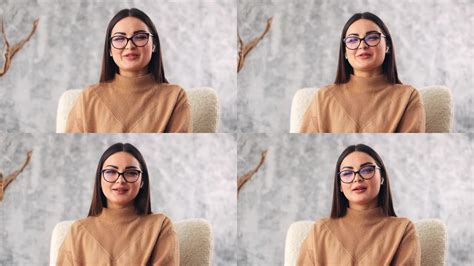 一个女人进行视频通话并使用智能手机或笔记本电脑的前置摄像头的特写镜头。美丽的女人微笑着挥手问好。视频视频素材下载编号21267915光