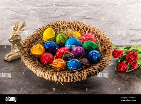 Easter Nest With Hay And Many Colorful Easter Eggs Easter Bunny And A