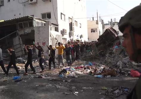 Moment Hamas Gunmen Are Stripped Half Naked Paraded With Rifles In