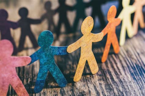 Colorful Paper Figures Hold Hands Symbolizing Unity Diversity And Collaboration In A Bright