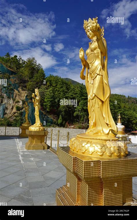 Shiny Golden Goddess Statues Line The Upper Terrace Around The Buddha