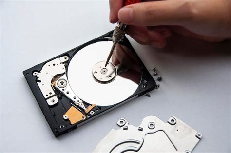 Premium Photo The Abstract Image Of Inside Of Hard Disk Drive With Technician Fixing Using