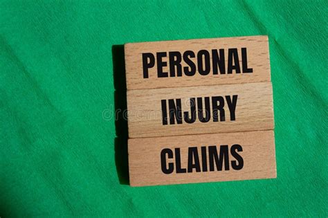 Personal Injury Claims Words Written On Wooden Blocks With Green