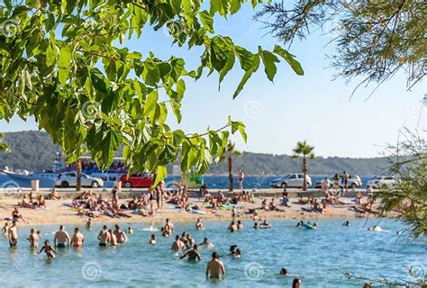 Many People In The Water At Beach On A Sunny Day In Summer At Kasjuni Beach In Split Croatia
