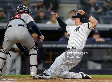 Mitch Garver Of The Minnesota Twins Takes Out Luke Voit Of The New