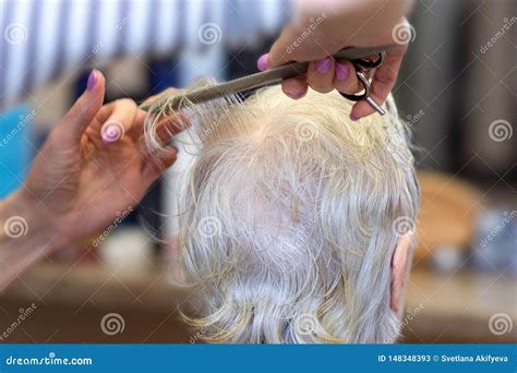 Haircut For The Elderly The Process Of Cutting Grandma`s Hair In The