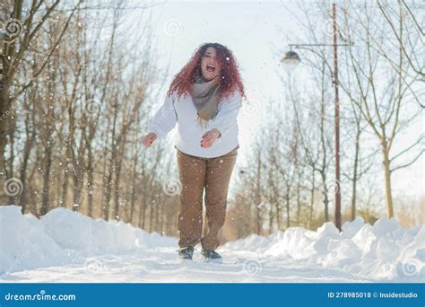 Smiling Chubby Redhead Woman Running In Park In Winter Stock Photo Image Of Pretty Ginger
