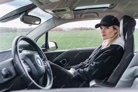 Premium Photo Beautiful Girl In The Passenger Seat Of The Car Is
