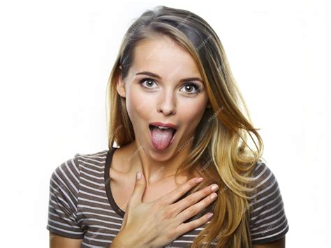 A Young Women Making A Teasing Expression With Her Tongue Out Premium