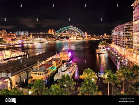 Elevated Panorama Of Sydney Harbour Circular Quay Bay At Night During