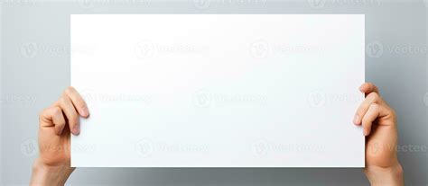 Man Displays Empty Sign Board With Copy Space On Studio Background