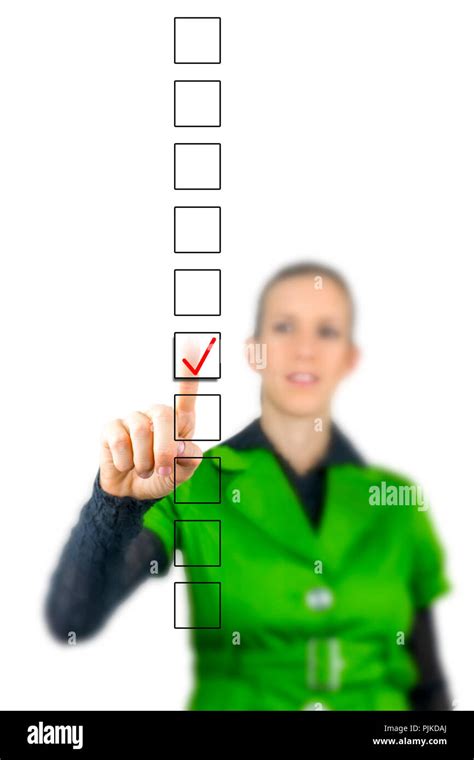 Woman Ticking A Check Box In A Vertical Line Of Empty Boxes In A Survey Or Questionnaire On A