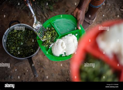 Serving Nshima Traditional Zambian Porridge And Vegetables For Lunch